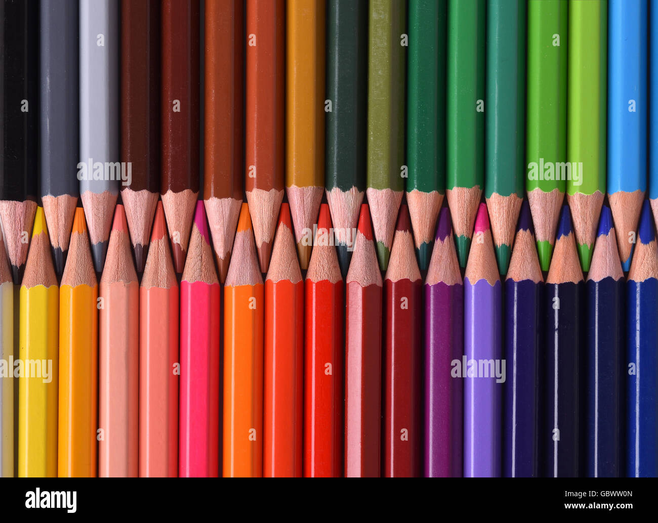 Background of colored pencils forming a color palette with the tips ...