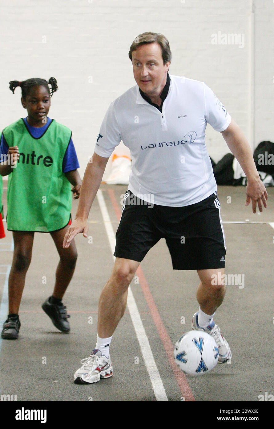 Conservative party leader David Cameron joins in with a game of ...