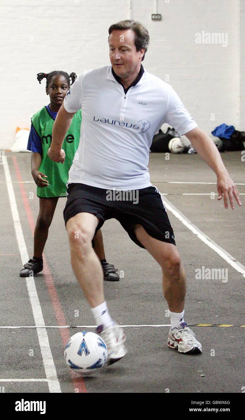 Conservative party leader David Cameron joins in with a game of ...