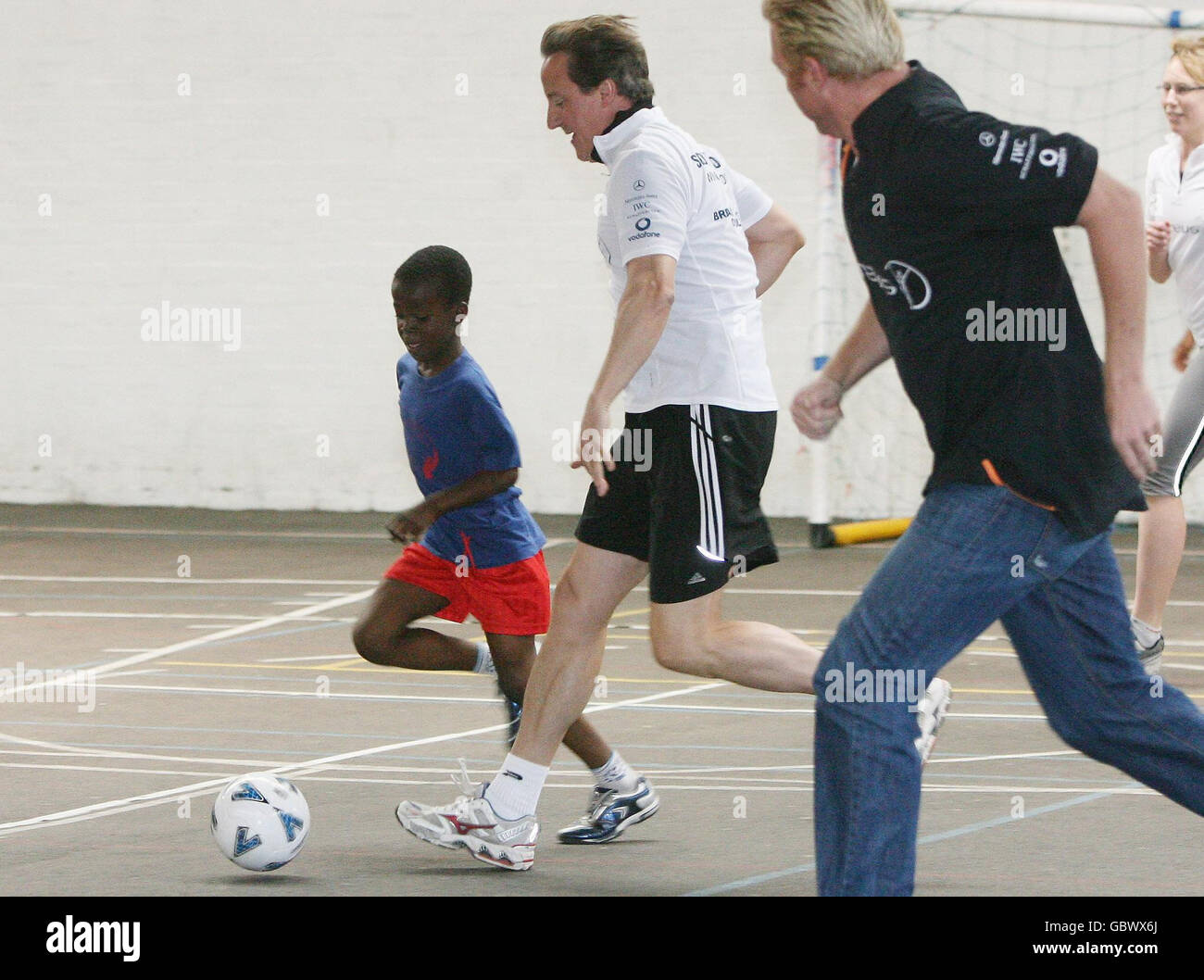 Conservative party leader David Cameron joins in with a game of ...