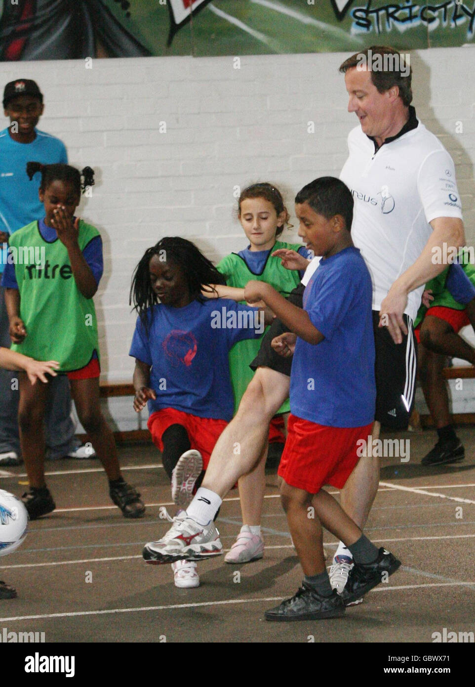 Conservative party leader David Cameron joins in with a game of ...