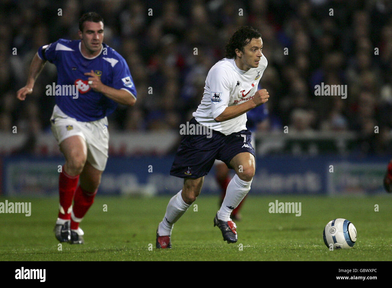 Tottenham Hotspur's Simon Davies (r) gets away from Portsmouth's David ...
