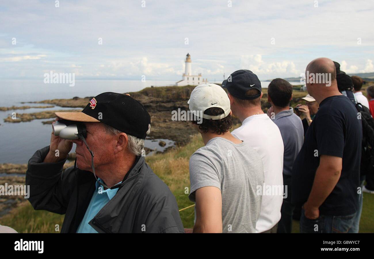 Spectators watch the action on the 9th hole during the third practice ...