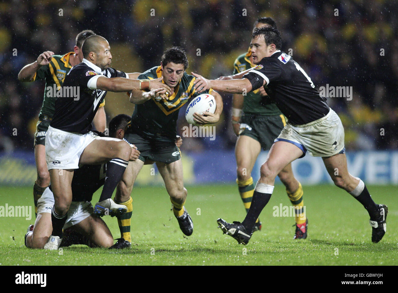 Australias craig gower bursts through the new zealand defence hi-res ...