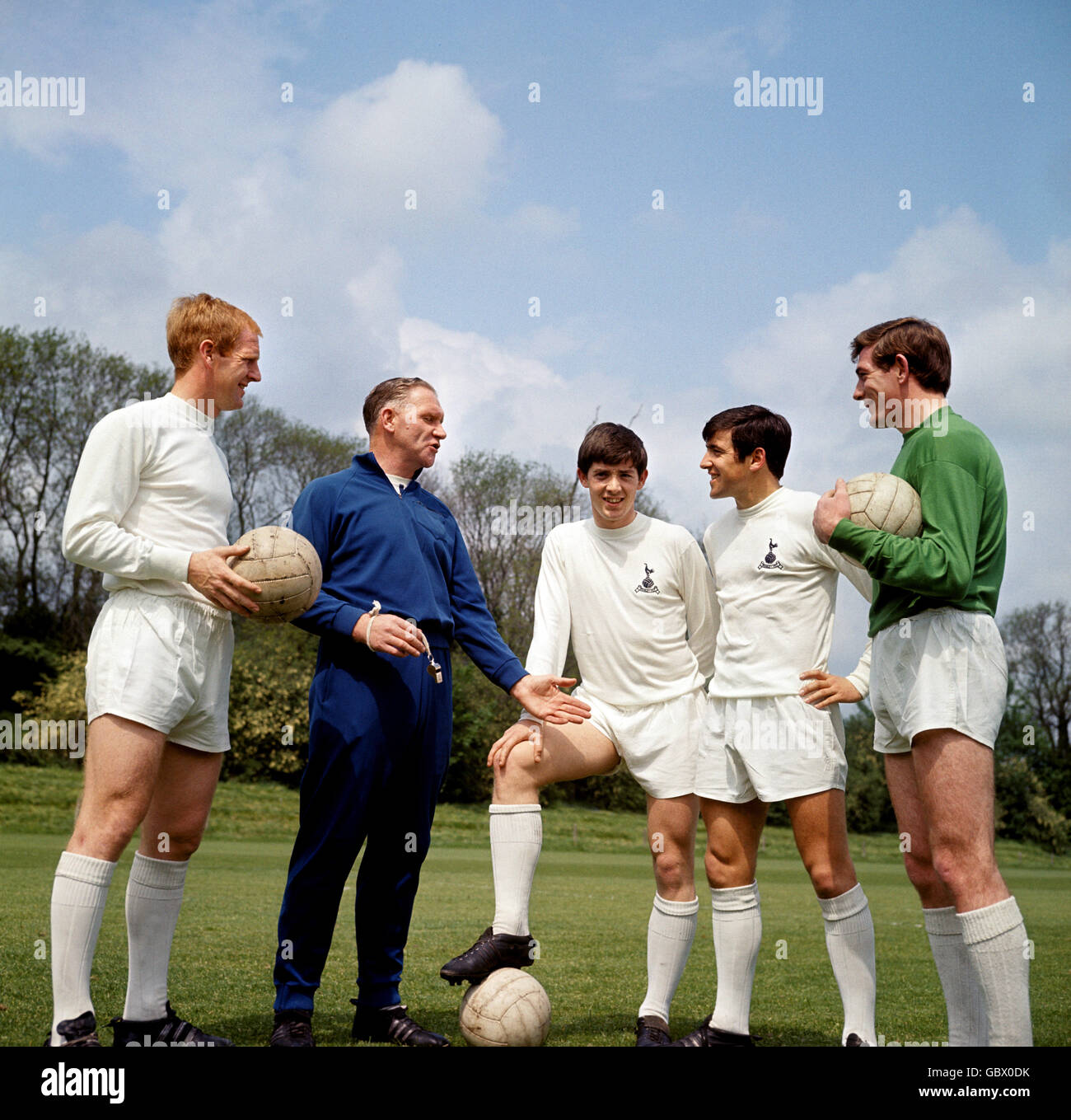 Tottenham Hotspur manager Bill Nicholson (second l) makes a point to (l ...