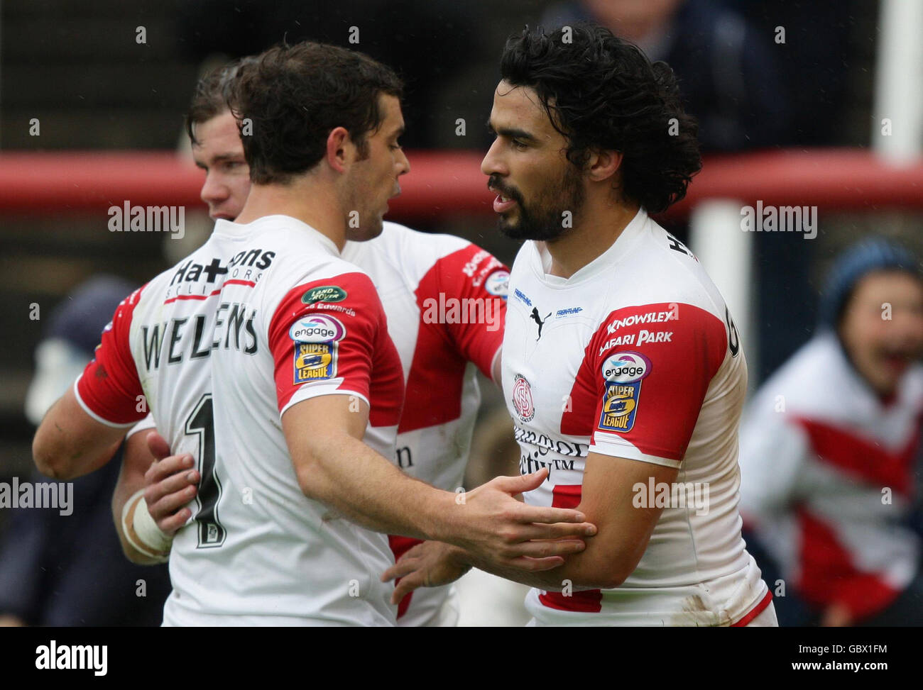 St Helens' Ade Gardner (right) celebrates scoring their first try with ...