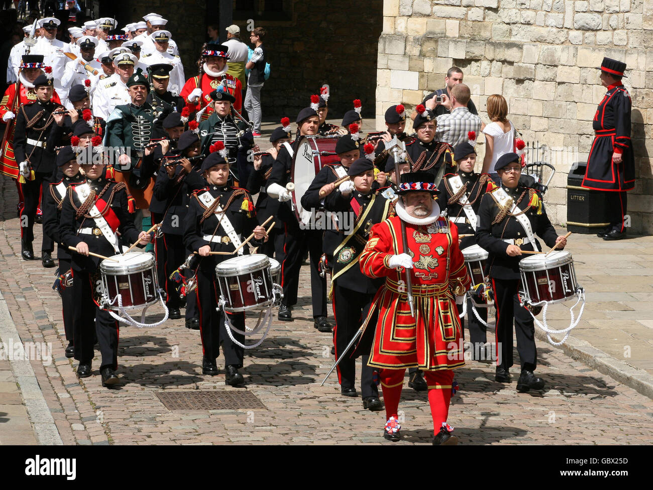 The crew of USS Halyburton are led through the Tower of London after ...