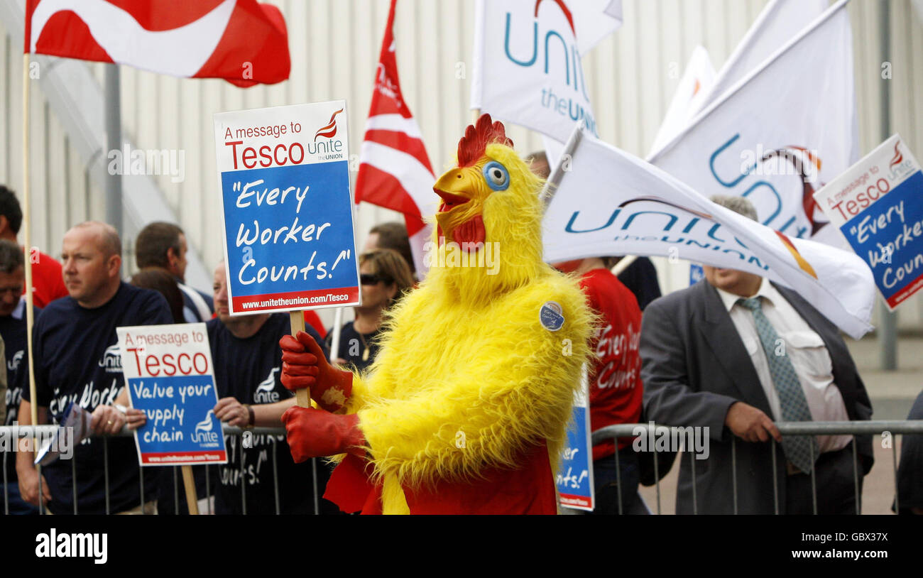 A protester dressed as a chicken demonstrates outside the Tesco AGM at ...