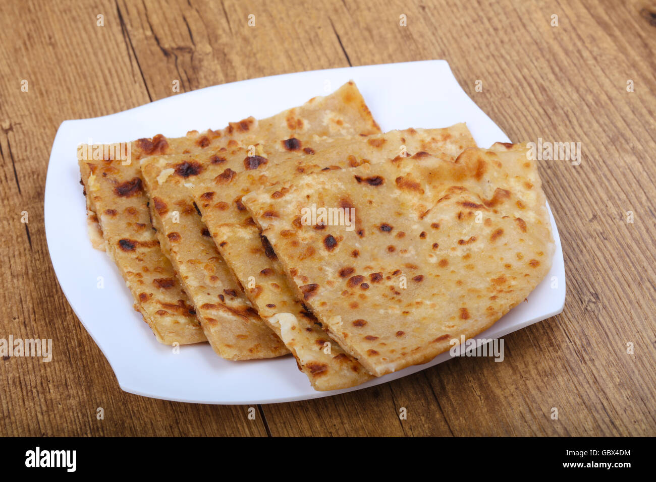 Indian bread roti on the plate in wood background Stock Photo - Alamy