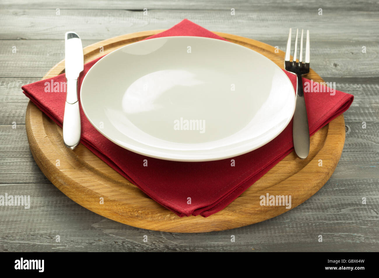 plate, knife and fork on rustic wooden background Stock Photo - Alamy