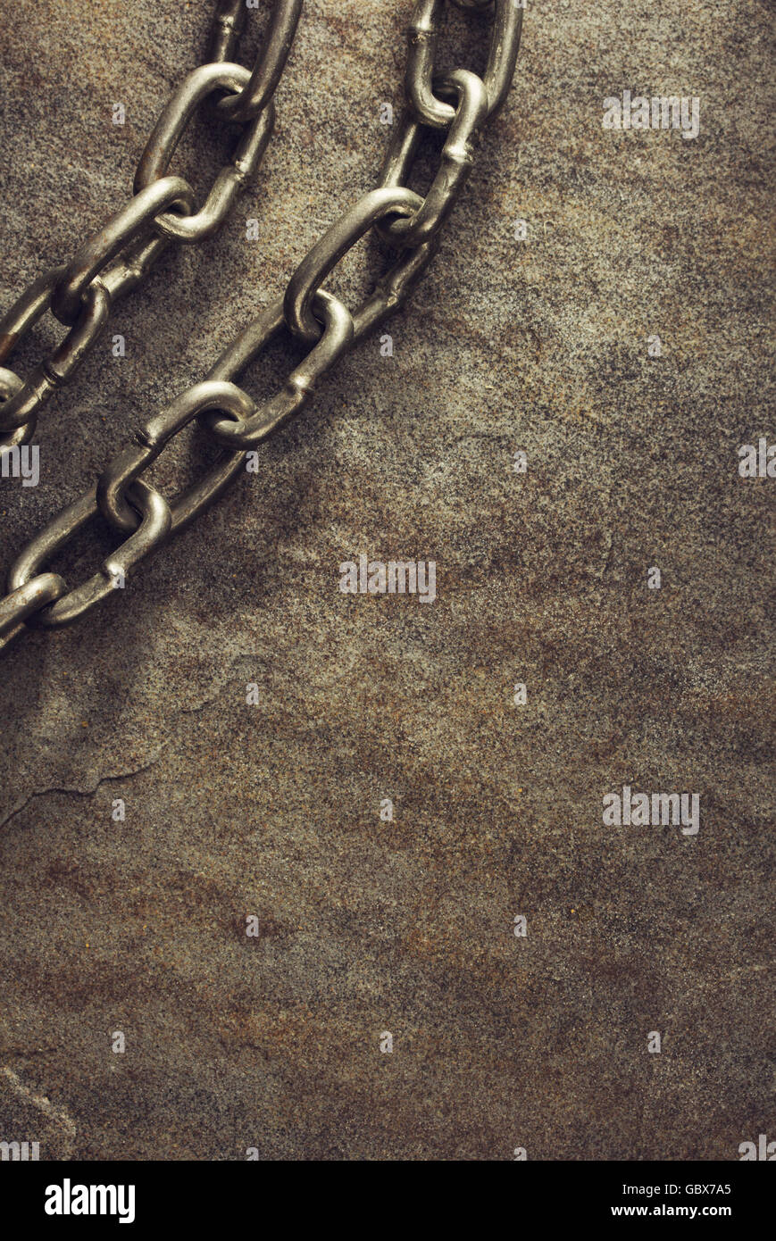 metal chain at stone background Stock Photo - Alamy