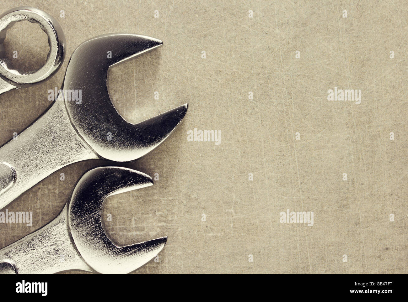 wrench tools at metal background Stock Photo - Alamy