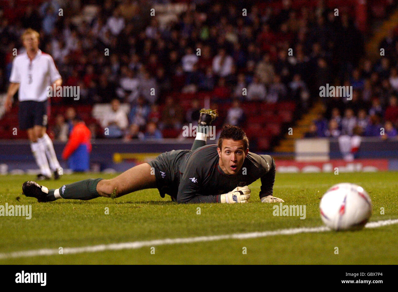 Wales' goalkeeper Lewis Price turns to see a shot go narrowly wide ...