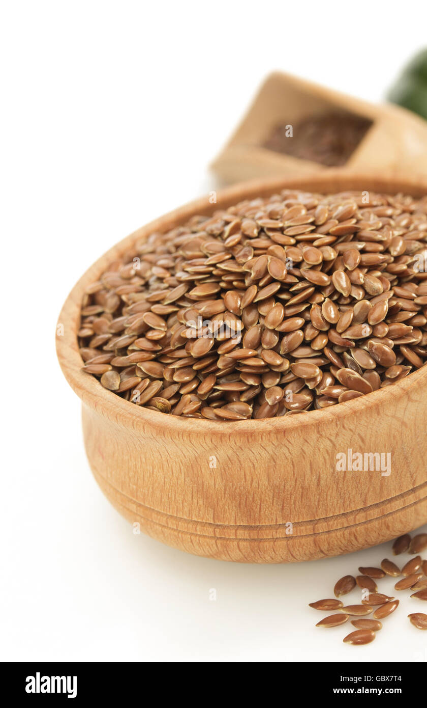 flax seeds in bowl isolated on white background Stock Photo - Alamy