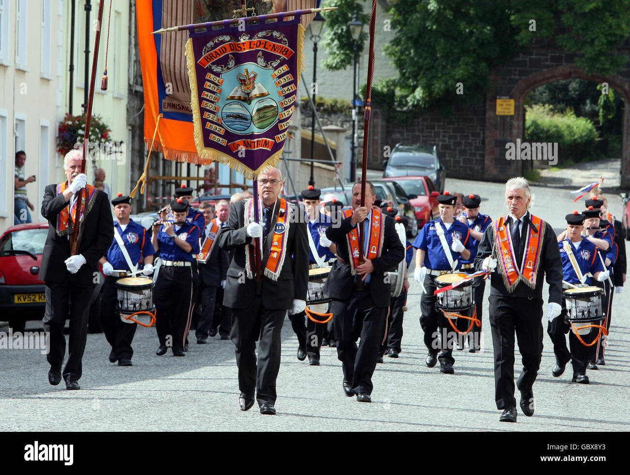 Orangemen on the march in Glenarm Co Antrim, Ulster during the Twelth ...