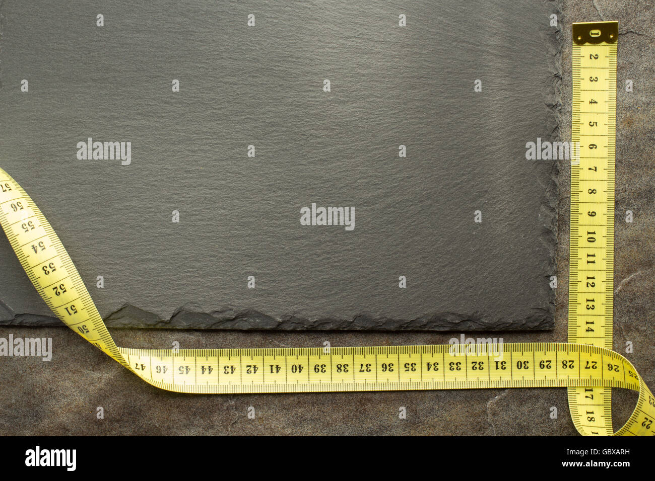 measuring tape on table background Stock Photo - Alamy