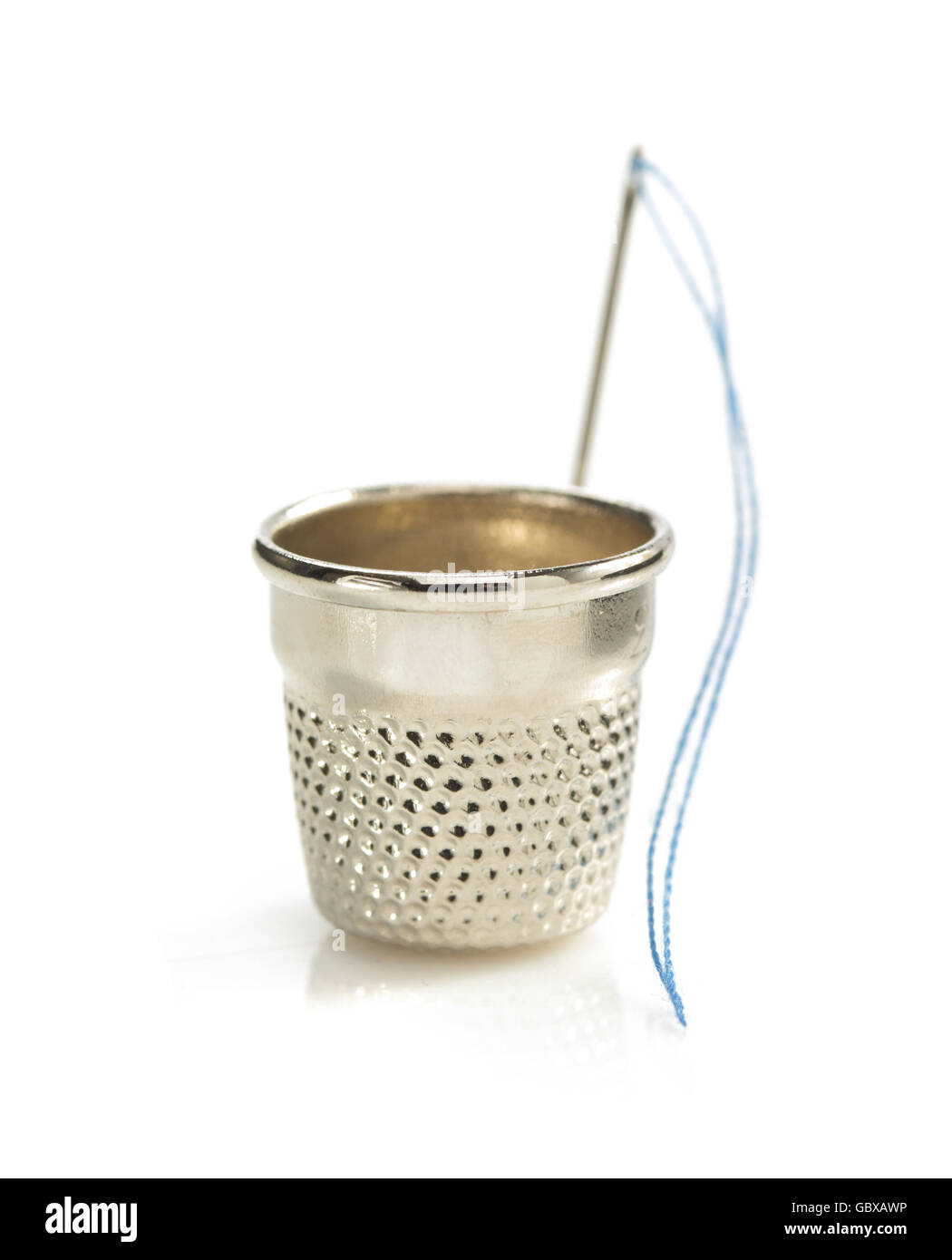 sewing thimble and thread with needle isolated on white background ...