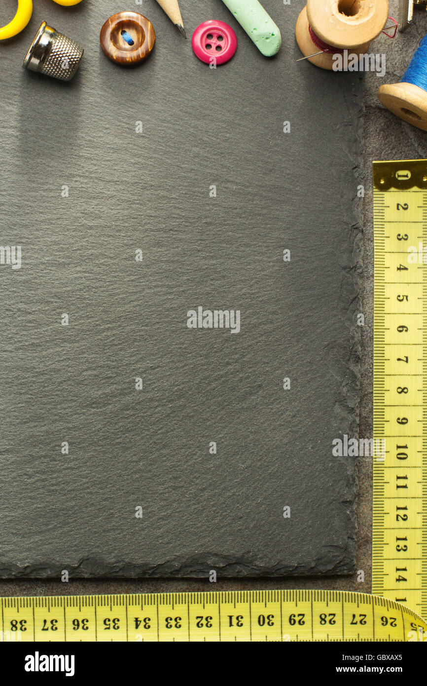 sewing tools and measuring tape on table background Stock Photo - Alamy