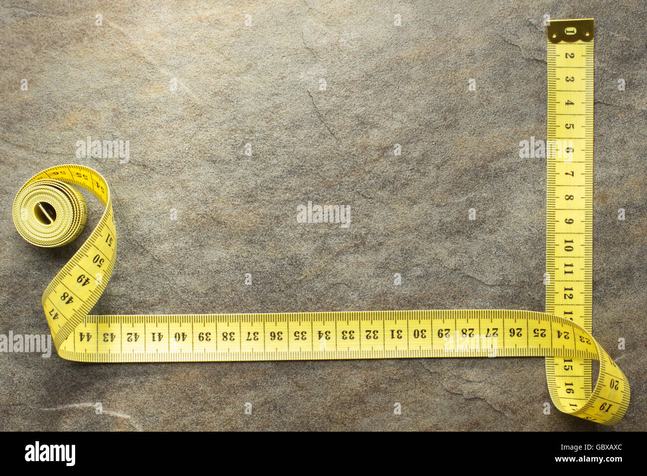 measuring tape on table background Stock Photo - Alamy
