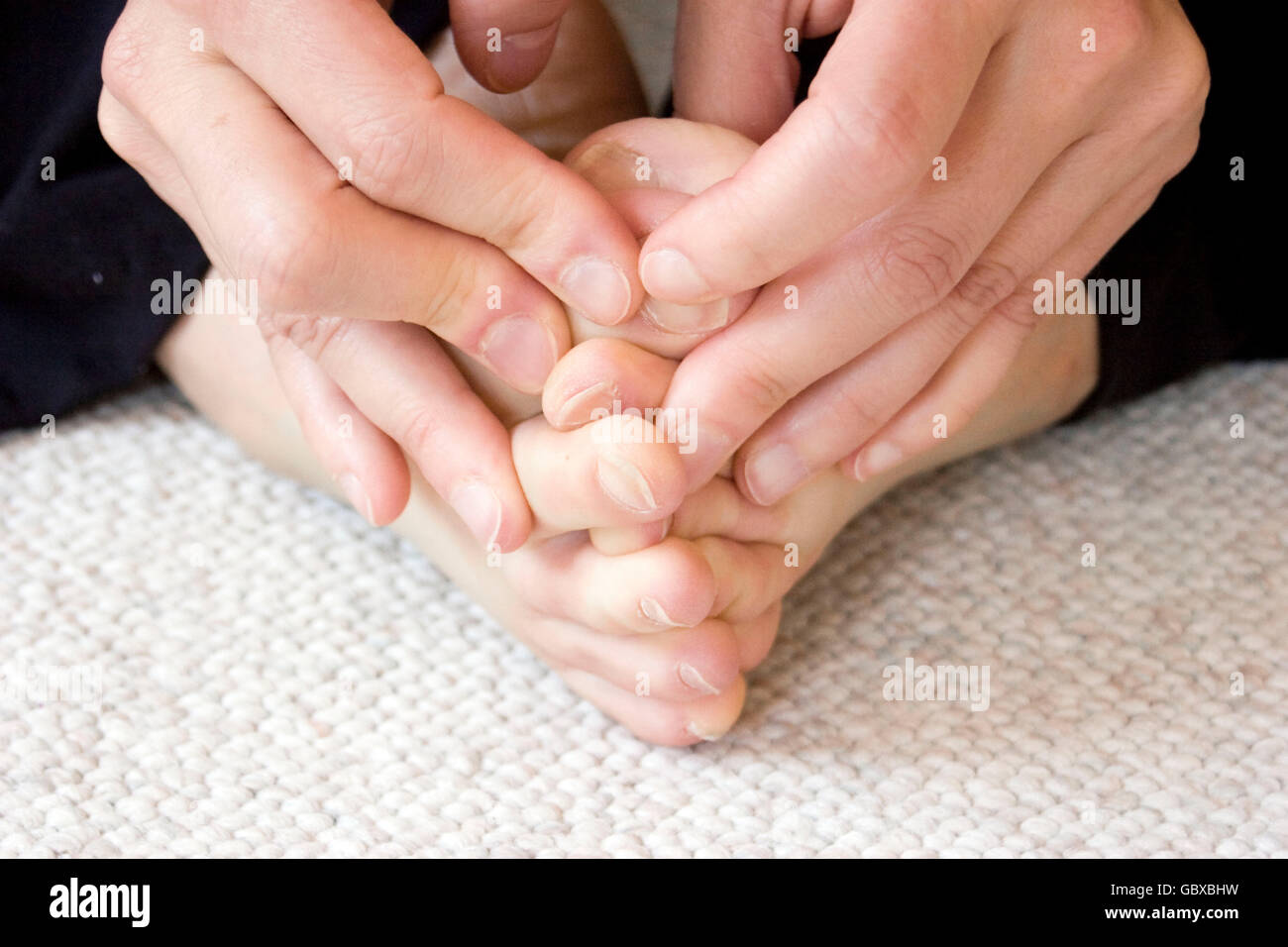Woman doing yoga in a studio. Pose: on the way to "Pada pada mudra ...