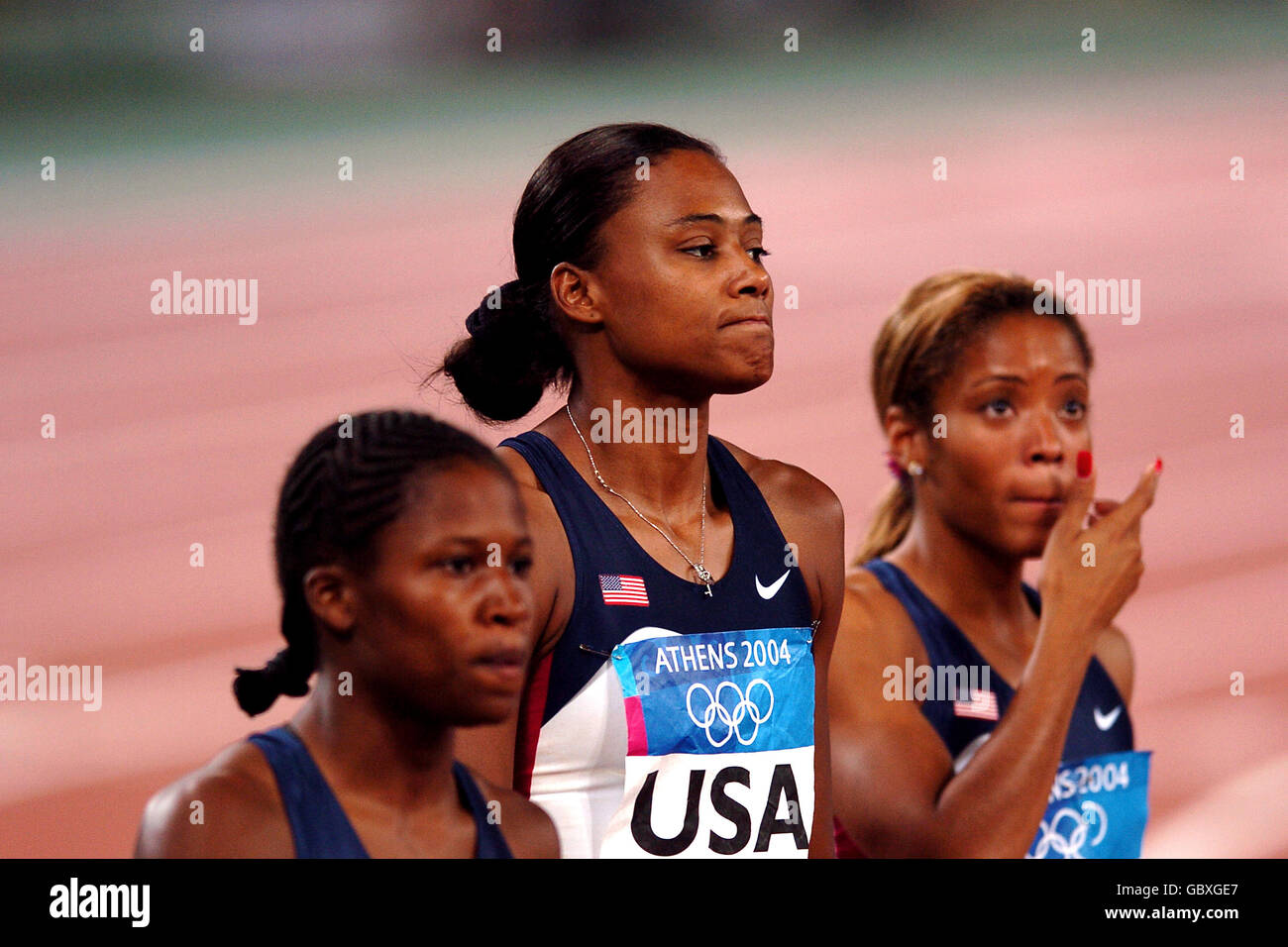 USA's (l-r) Lauryn Williams, Marion Jones and LaTasha Colander look ...