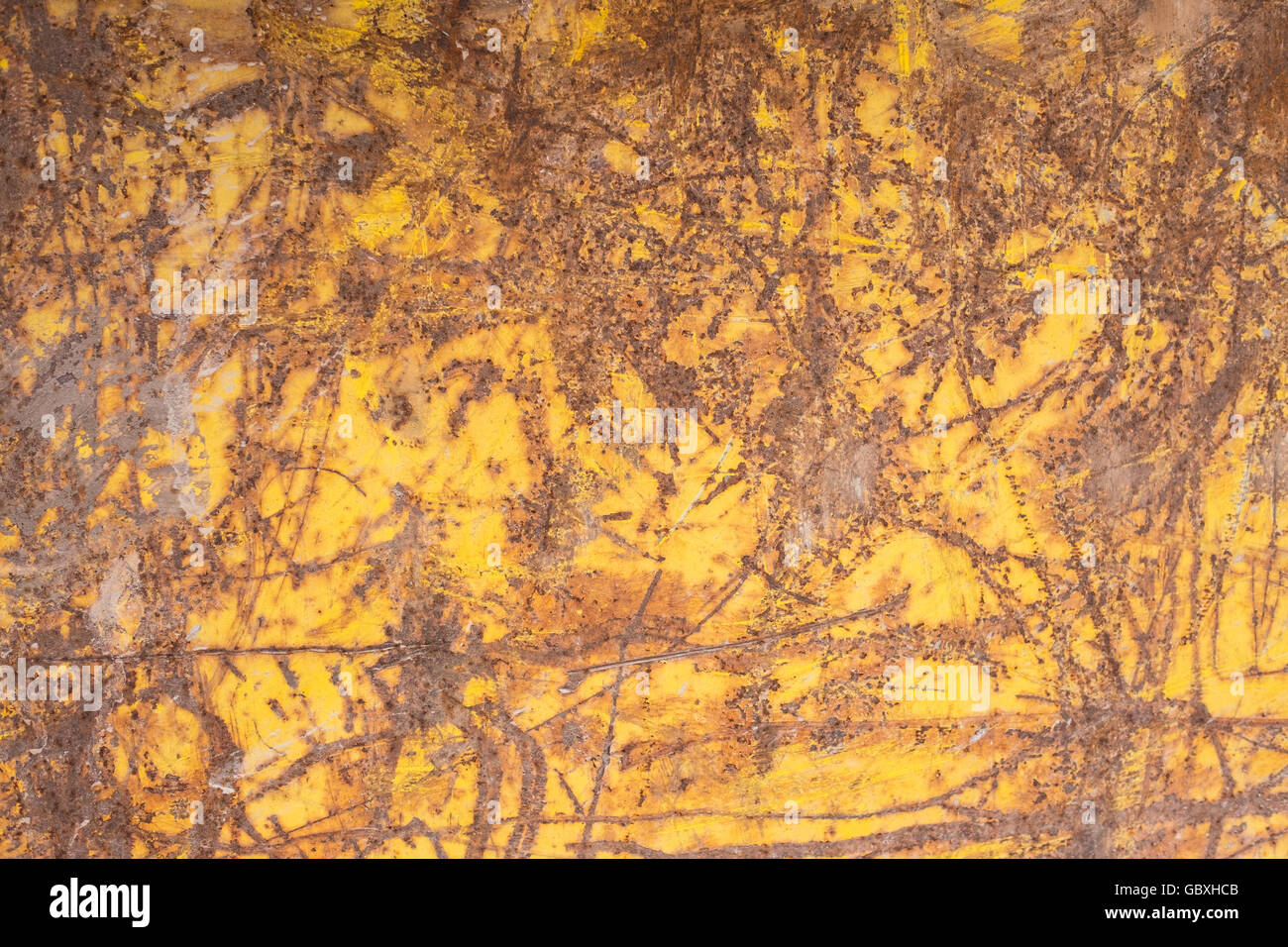 Yellow metal background with rust and scratches Stock Photo - Alamy
