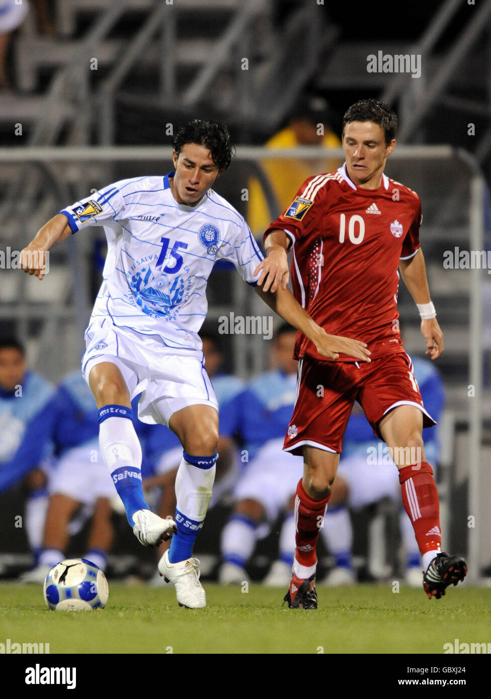 El Salvador's Alfredo Alberto Pacheco (left) and Canada's Will Johnson ...
