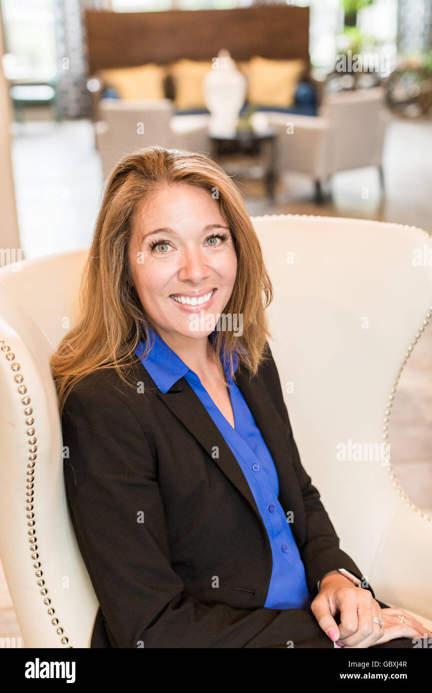 Portrait of business woman in blue shirt Stock Photo - Alamy