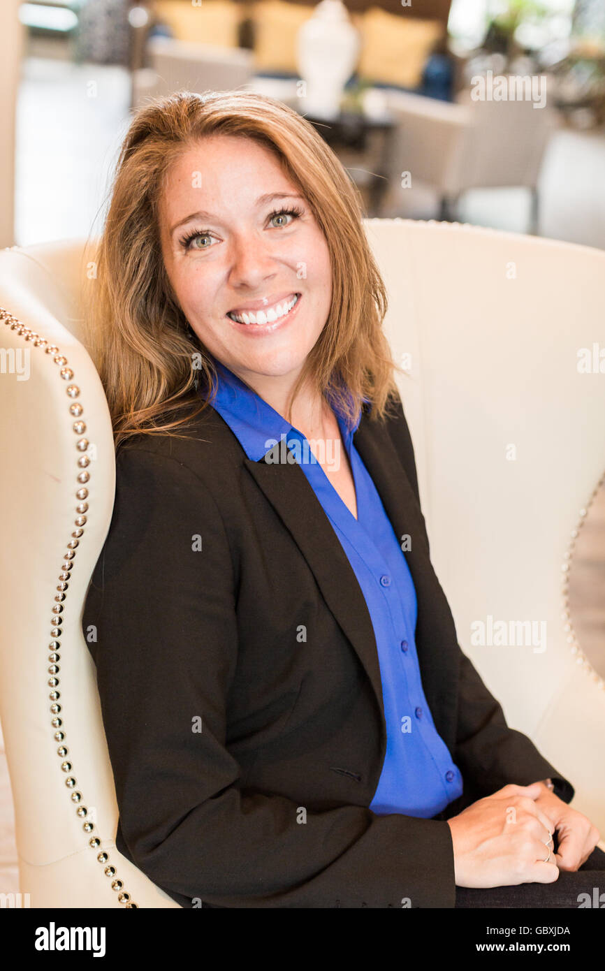 Portrait of business woman in blue shirt Stock Photo - Alamy