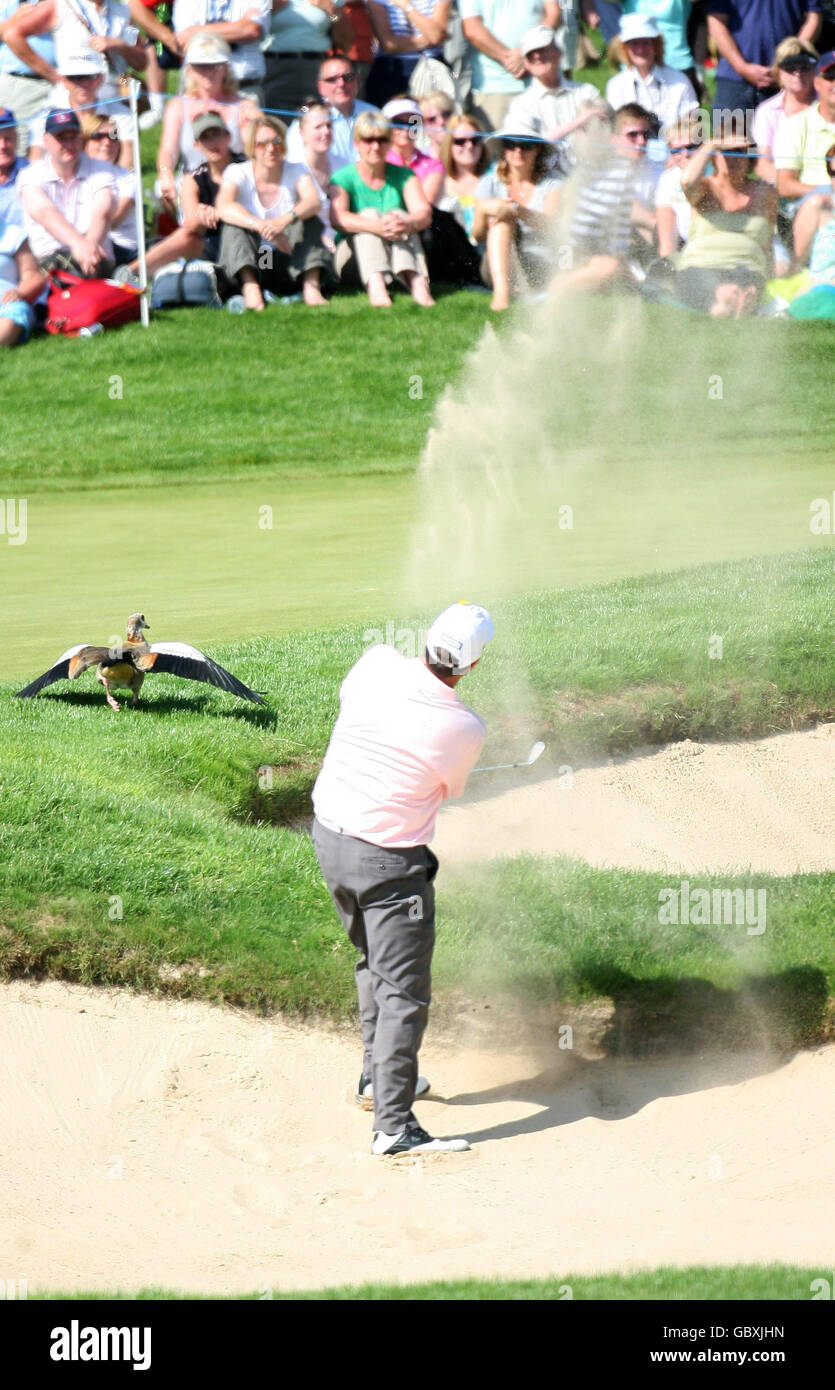 England's Kenneth Ferrie plays a bunker shot on 18th watched by the ...