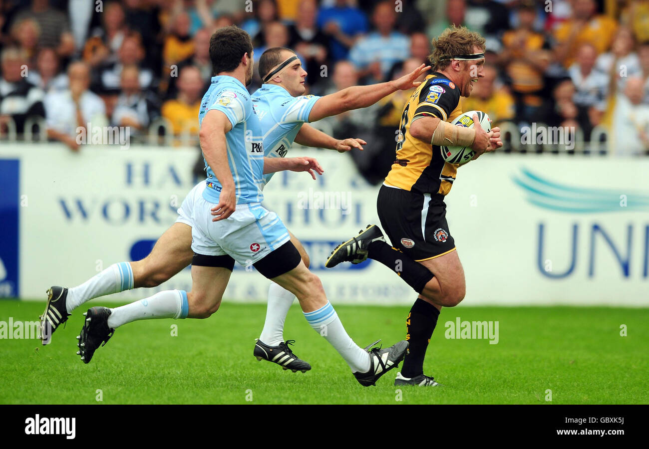 Castleford's Ryan Hudson (right) breaks free from Hull FC's Chris ...