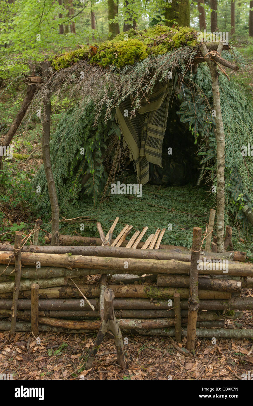 Survival shelter and survivor concept. A-frame shelter construction ...