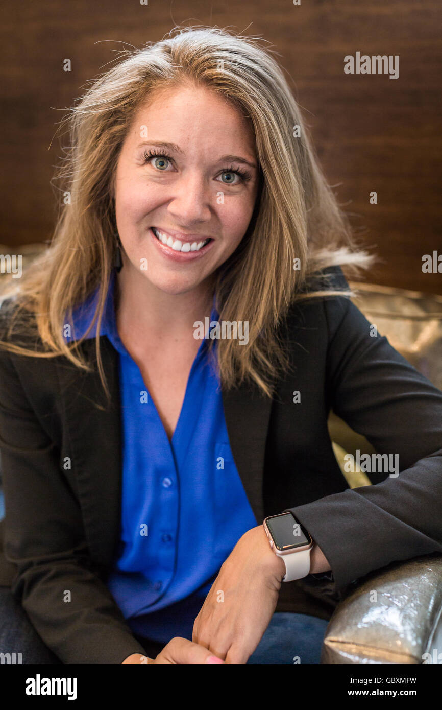 Portrait of business woman in blue shirt Stock Photo - Alamy