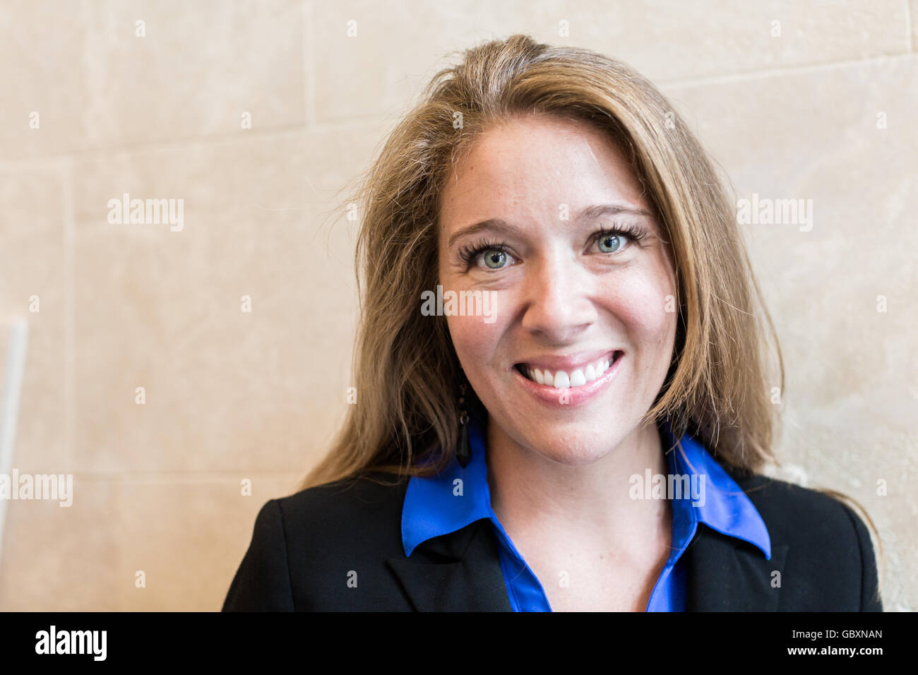 Portrait of business woman in blue shirt Stock Photo - Alamy
