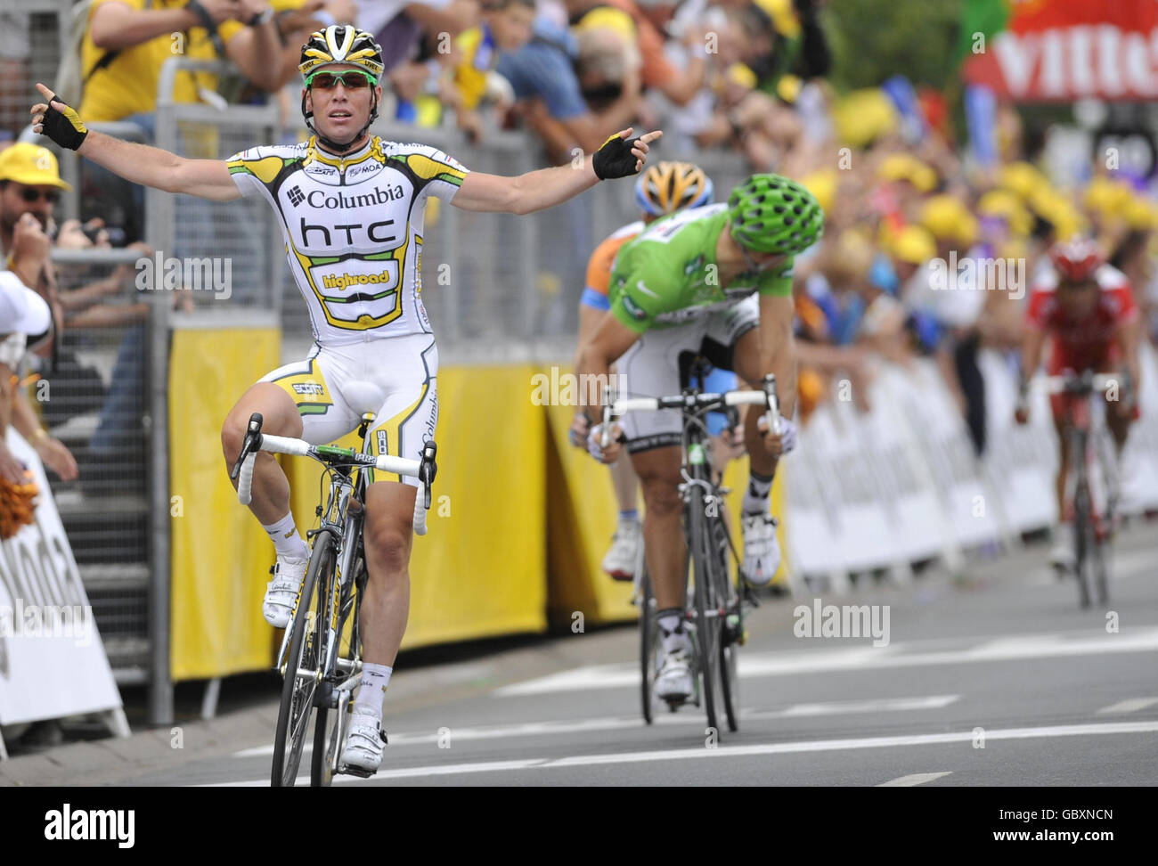 Mark Cavendish crosses over the finish line to win the 10th Stage of ...