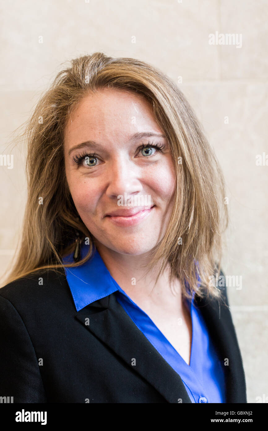 Portrait of business woman in blue shirt Stock Photo - Alamy