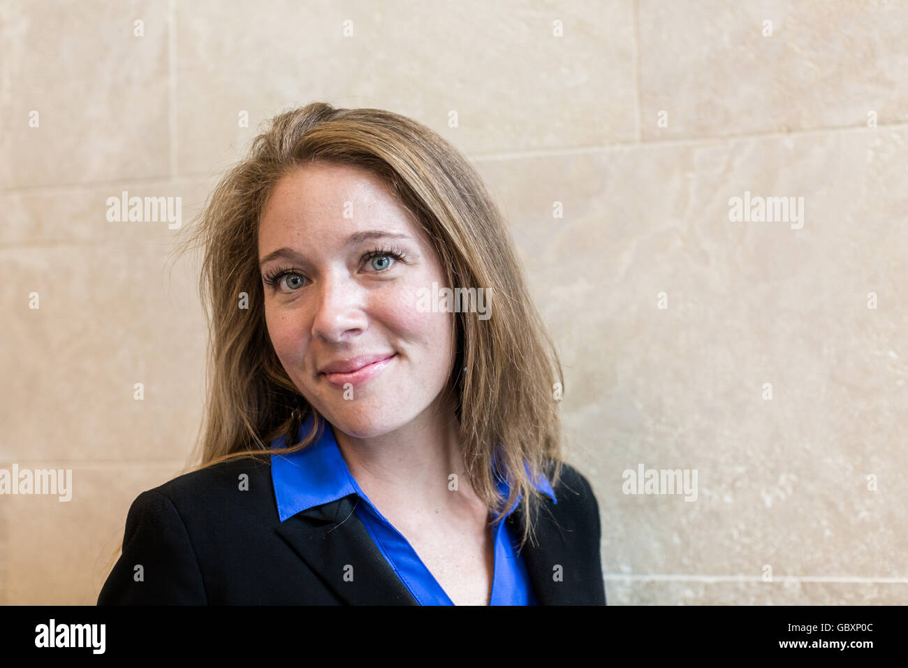 Portrait of business woman in blue shirt Stock Photo - Alamy