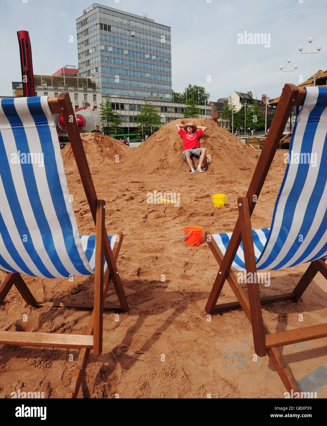 A Nottingham resident relaxes whilst work gets underway with three ...