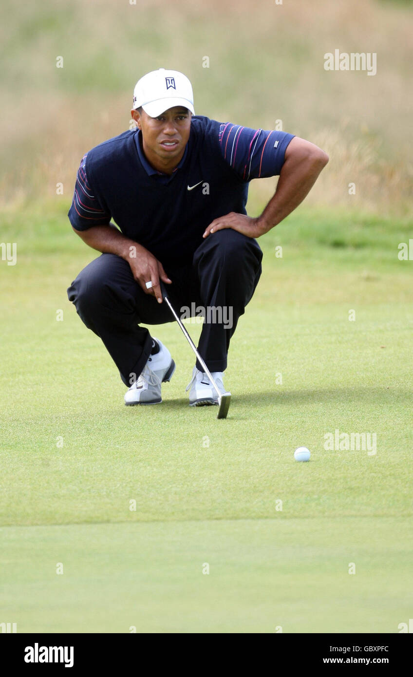 USA's Tiger Woods lines up a putt during the first round of the Open ...