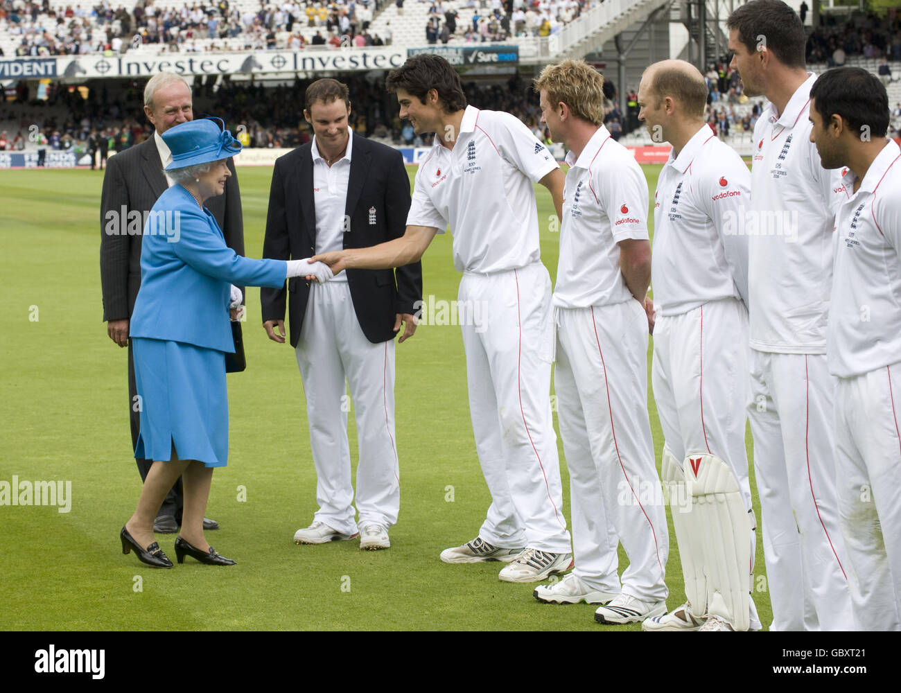 Queen Elizabeth II shakes hands with Alastair Cook as she meets the ...