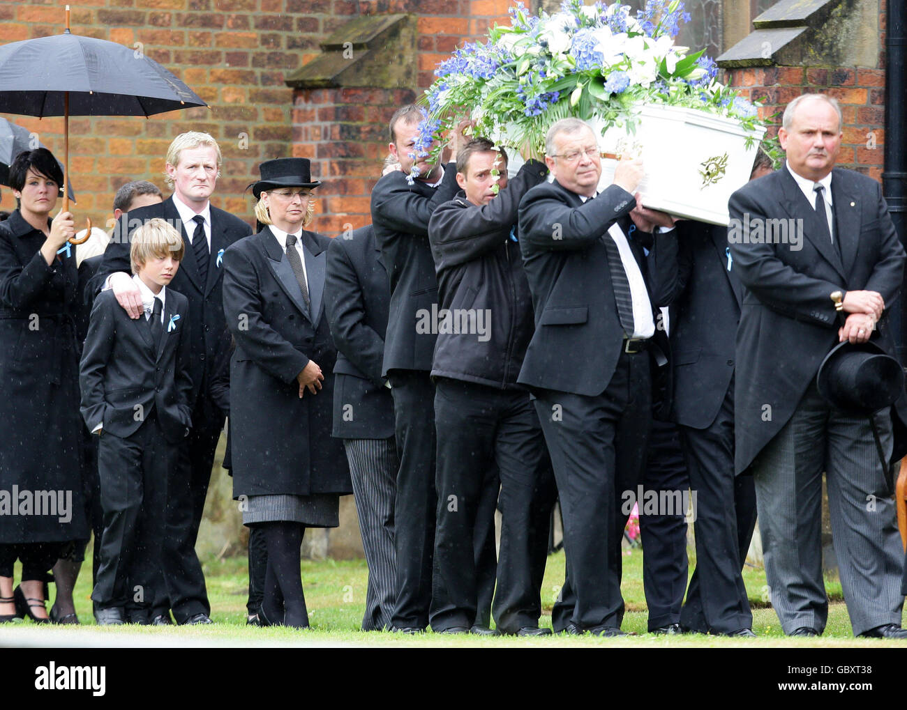 Colin Hendry puts his arm around son Callum as the coffin of Denise ...