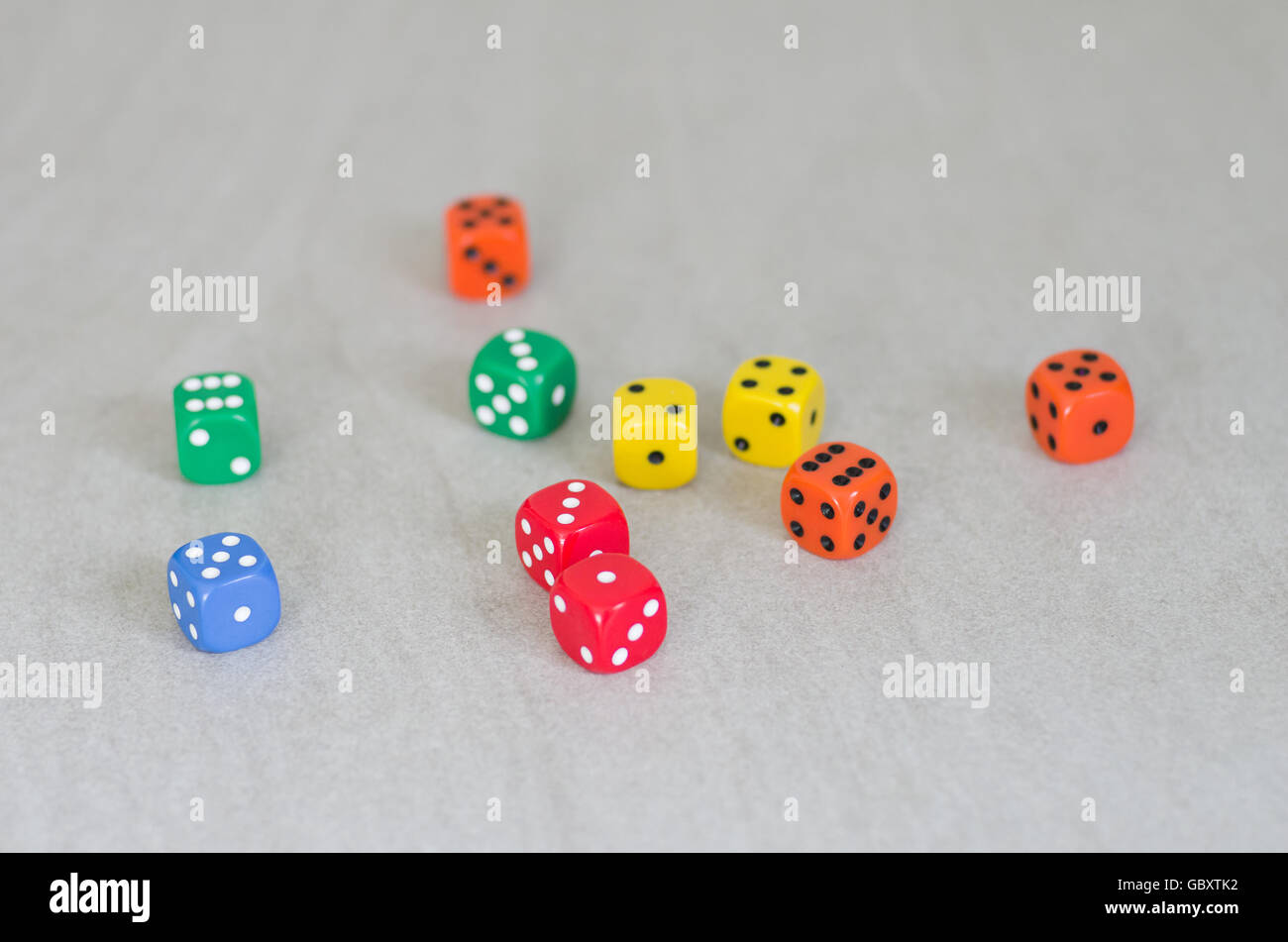 Coloured dice, coloured die Stock Photo - Alamy