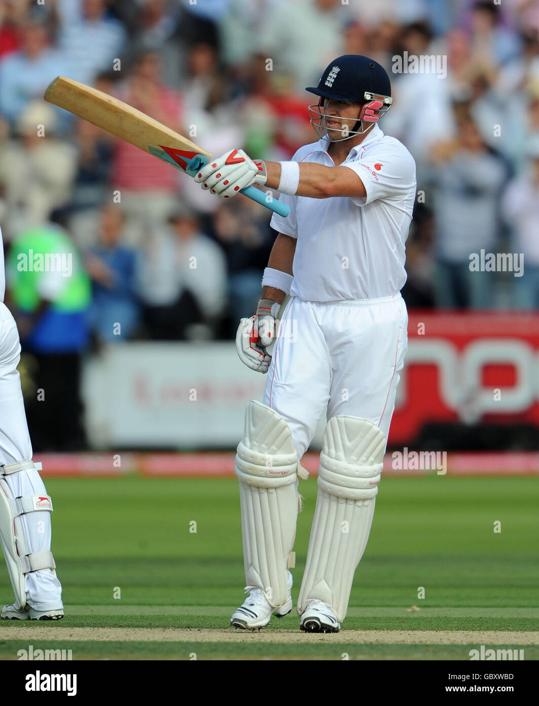 England's Matt Prior raises his bat to the crowd after reaching his 50 ...