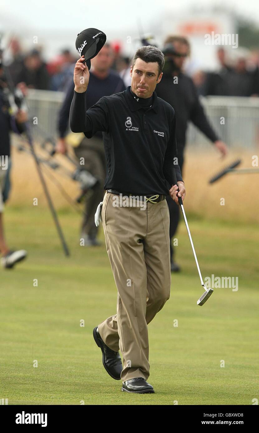 England's Ross Fisher acknowledges the crowd as he walks down the 18th ...
