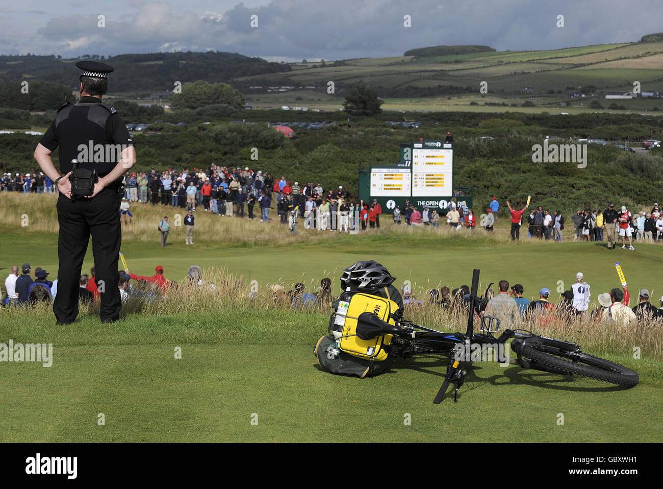 A policeman and his bike during the third day of the Open Championship ...