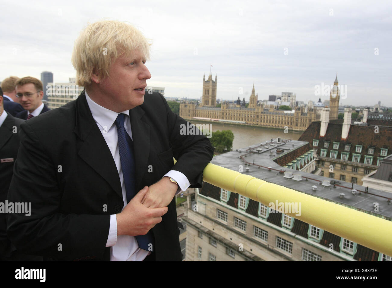 The Mayor of London Boris Johnson points towards Big Ben and the Houses ...