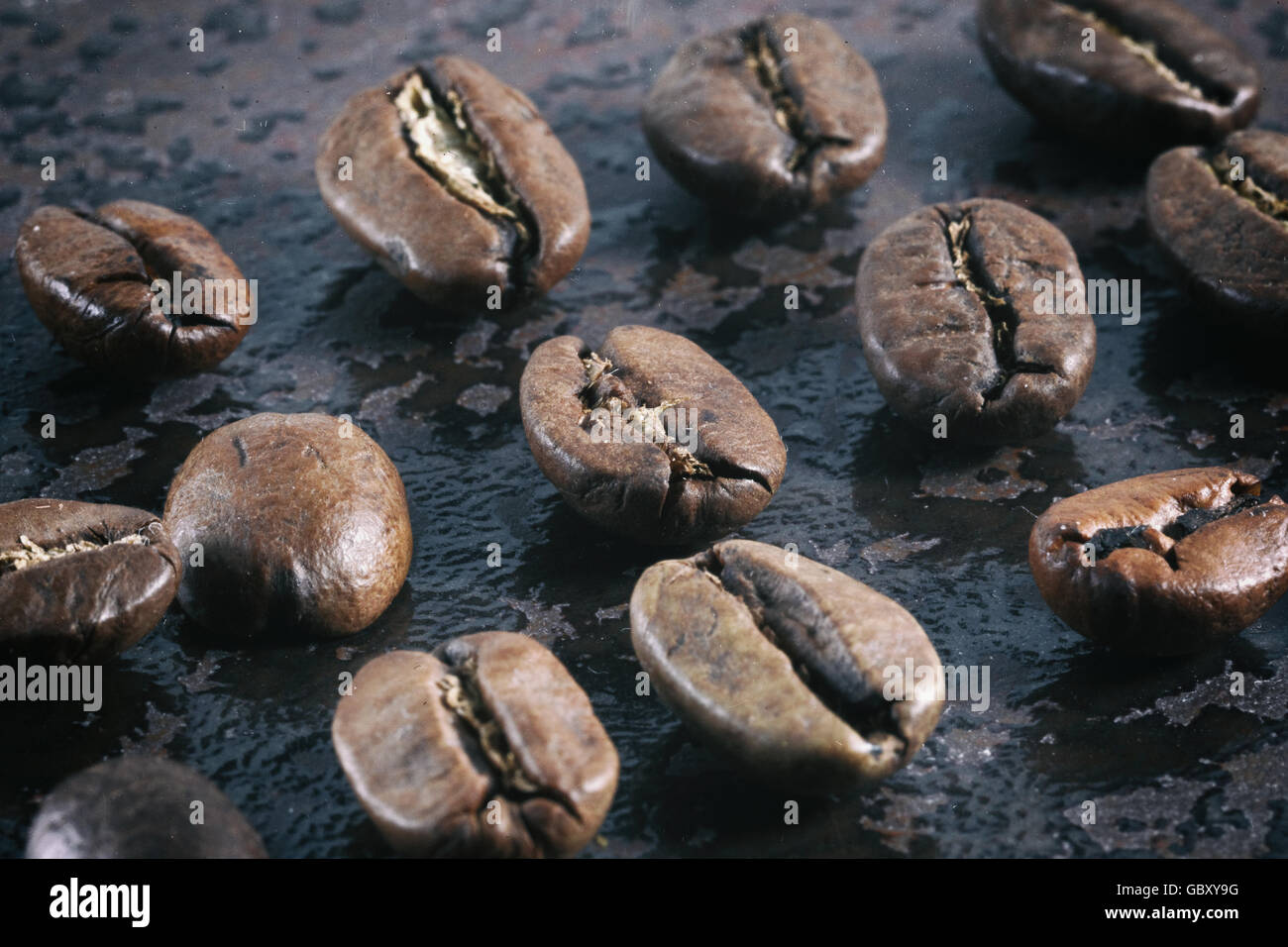 Vintage photo of coffee beans on a stone background Stock Photo - Alamy
