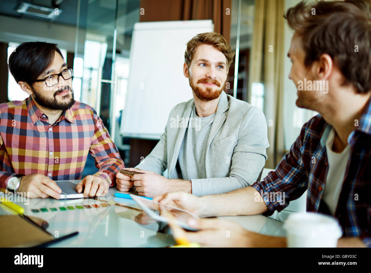 Businessmen planning together at the table Stock Photo - Alamy