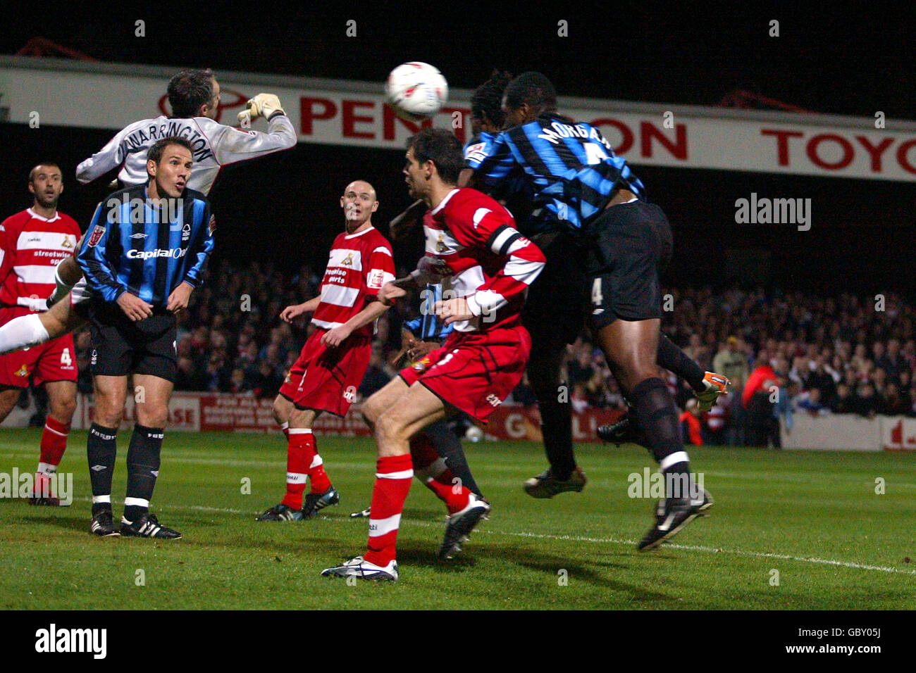 Doncaster Rovers' goalkeeper Andy Warrington (3rd l) attempts to clear ...