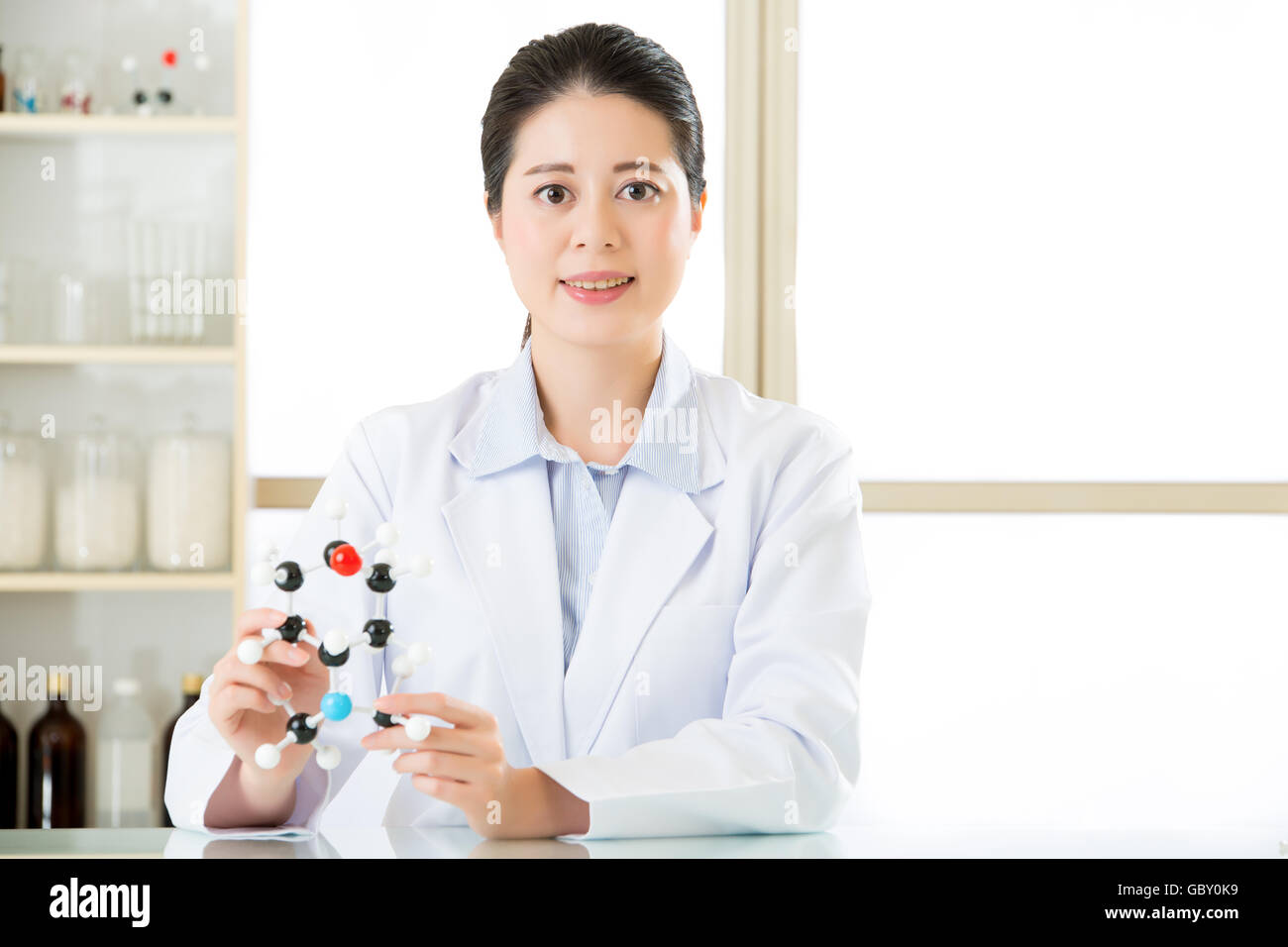 asian female scientist Examining the building blocks of life with ...